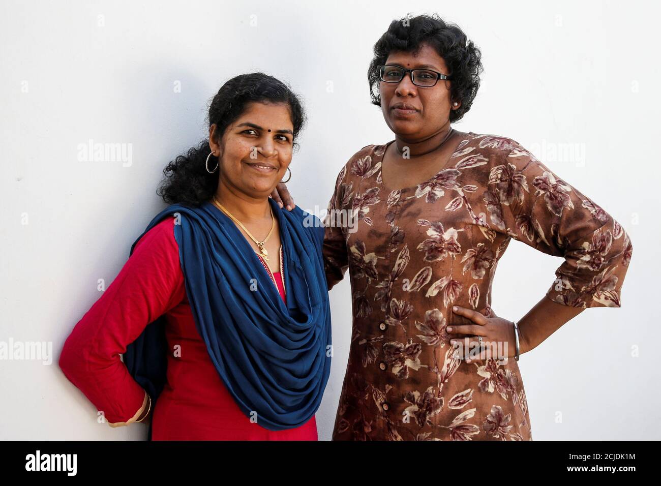 Women enter a temple hi-res stock photography and images - Alamy