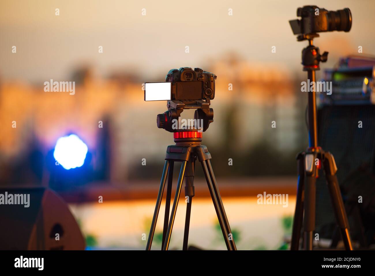 Camera with white blank screen filming live jazz concert performance ...