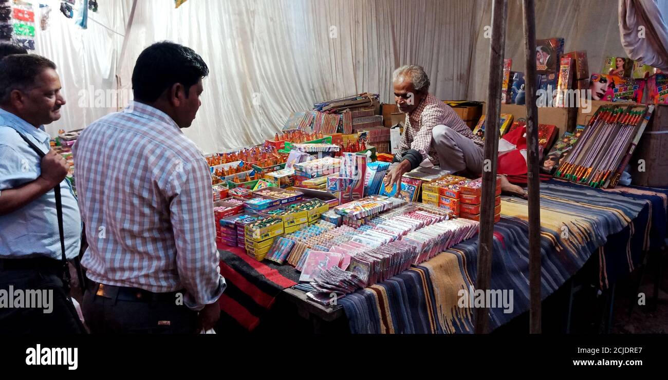 DISTRICT KATNI, INDIA - OCTOBER 15, 2019: An indian village man buying ...