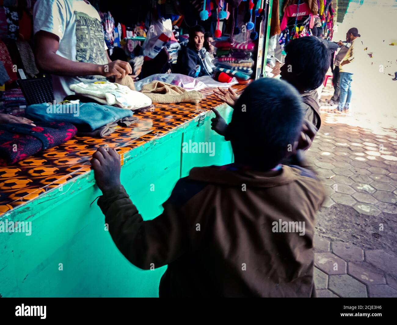 DISTRICT KATNI, INDIA - DECEMBER 06, 2019: Poor kids looking winter ...