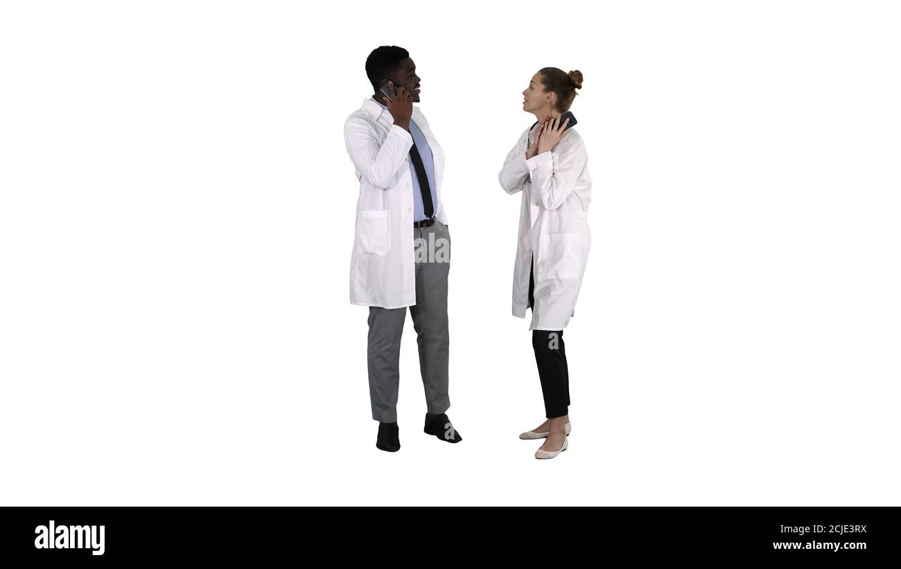 Female and male doctor using mobile phones making calls telling Stock ...