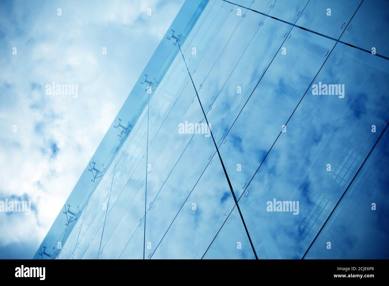 Front view of sky and cloud reflection on modern office building glass ...