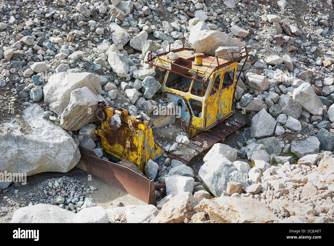 Old destroyed yellow tractor in mountains Stock Photo - Alamy