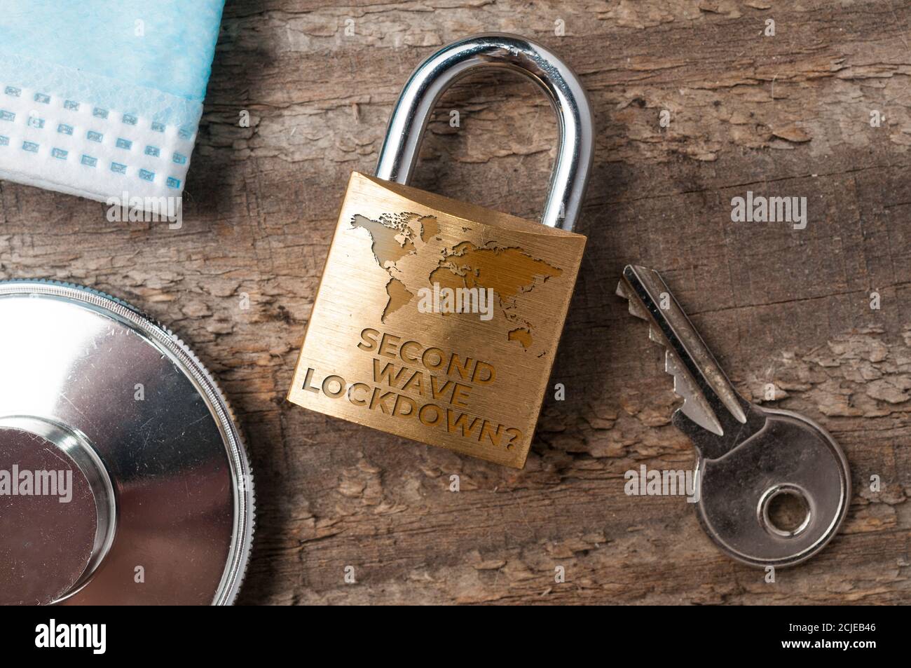 Covid-19 lockdown concept: a lock sorrounded by a key, a stethoscope ...