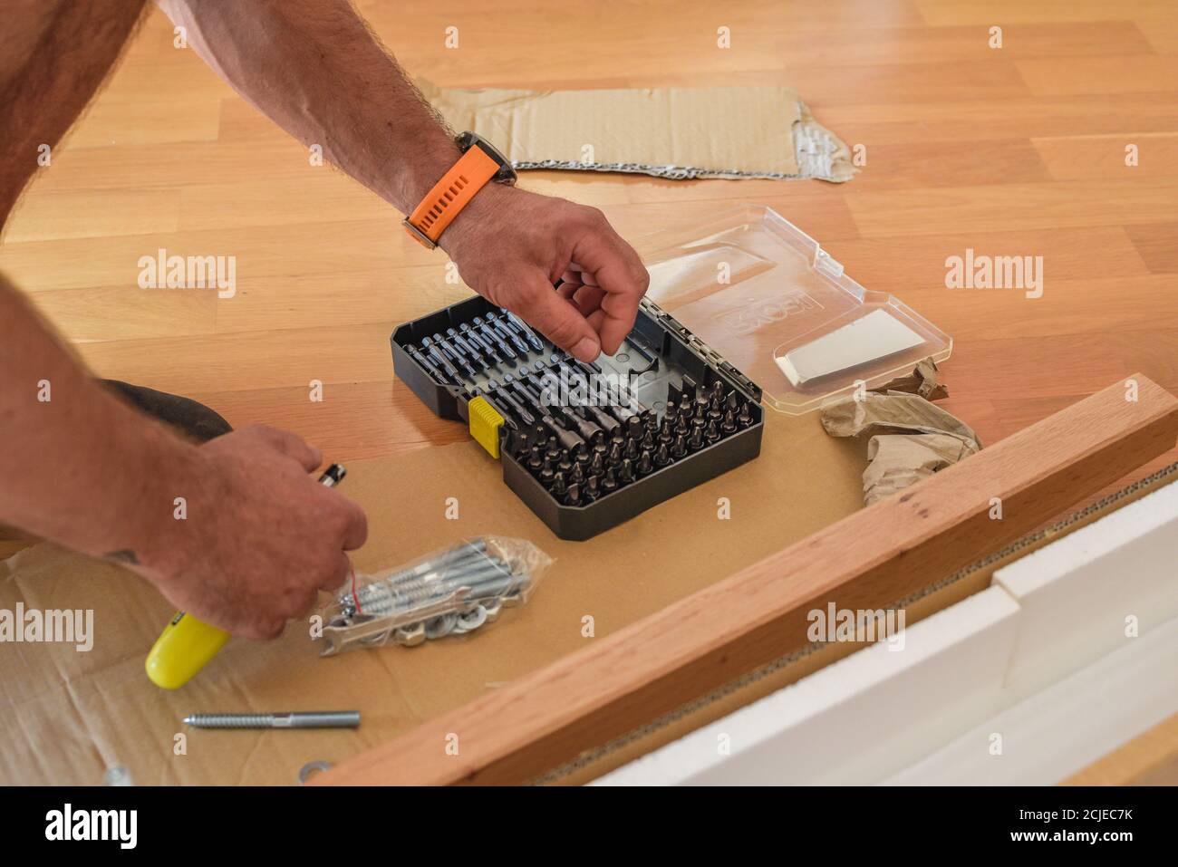 Closeup shot of a handyman picking a screw from a toolbox Stock Photo ...