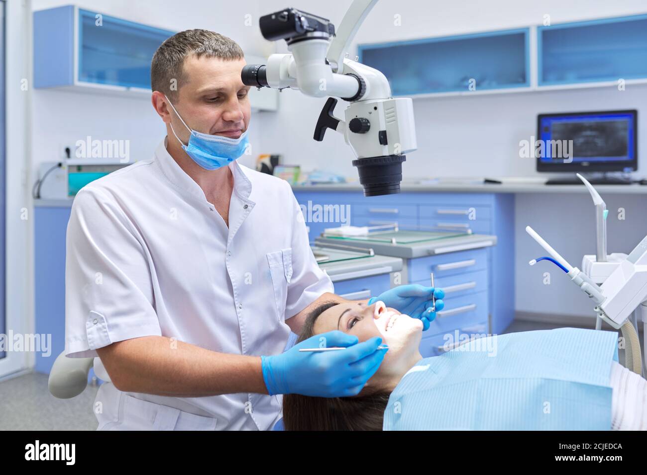 Treating teeth hi-res stock photography and images - Alamy