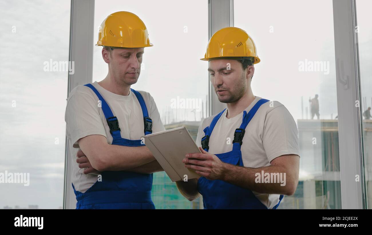 Construction specialist using tablet hi-res stock photography and ...