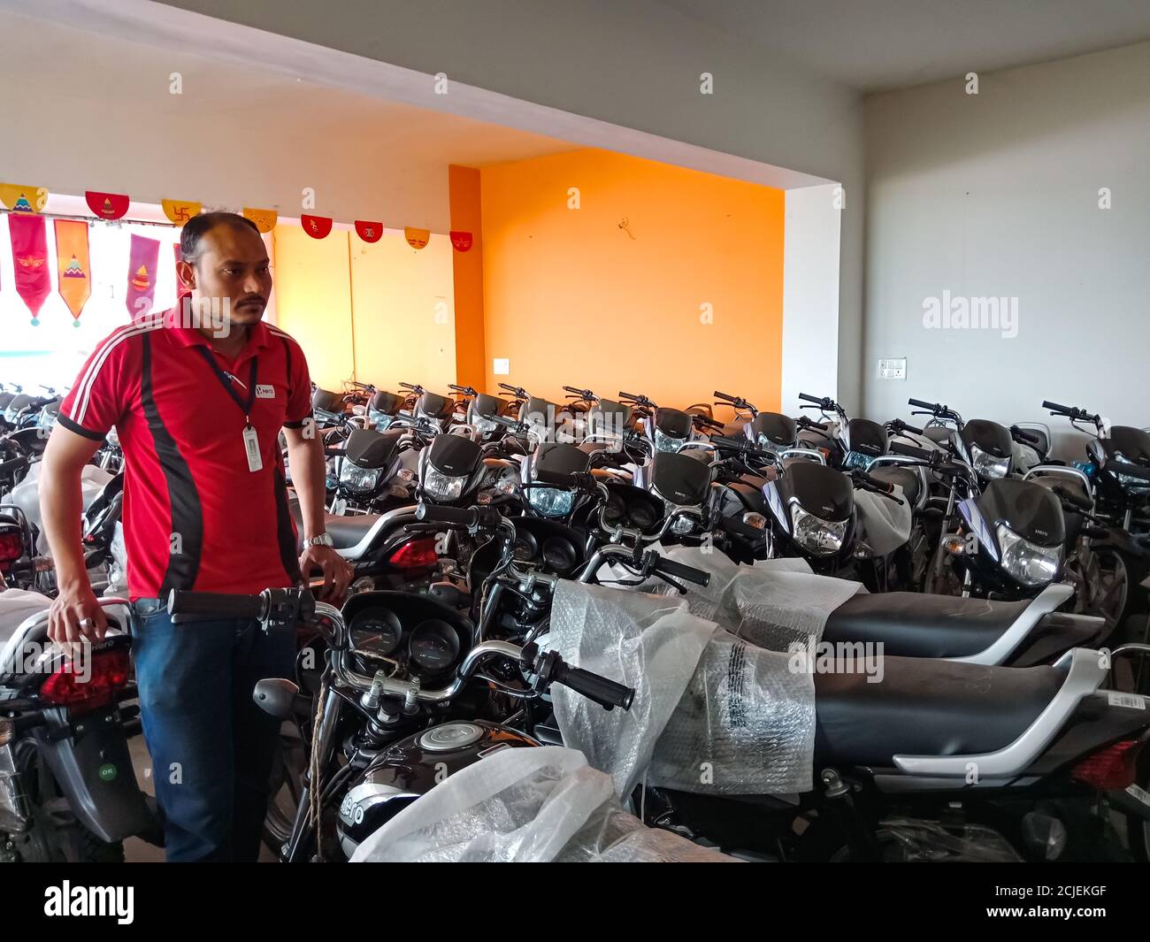 DISTRICT KATNI, INDIA - JANUARY 29, 2020: An Asian Salesman presenting ...