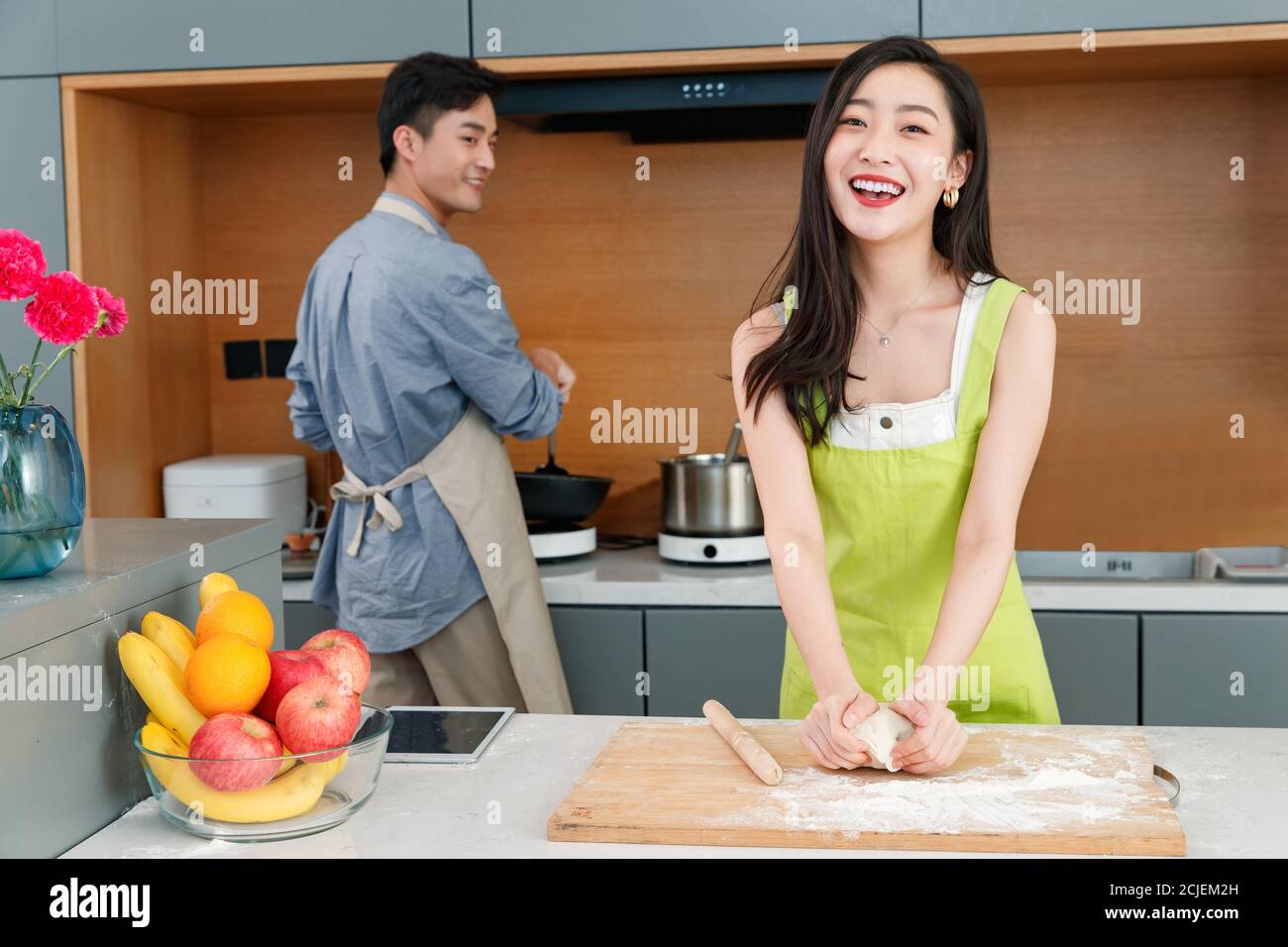 Happy couples of cooking in the kitchen Stock Photo - Alamy
