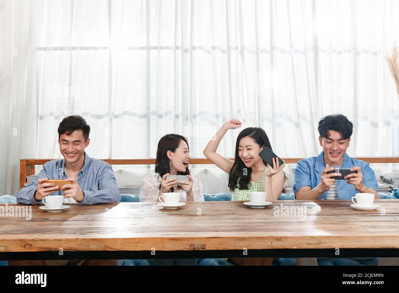 Four chinese friends using hi-res stock photography and images - Alamy