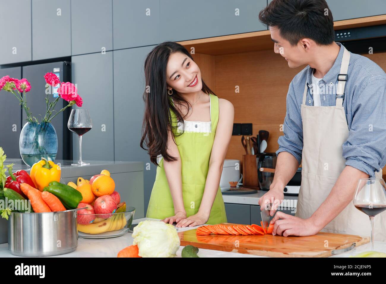 Happy couples of cooking in the kitchen Stock Photo - Alamy