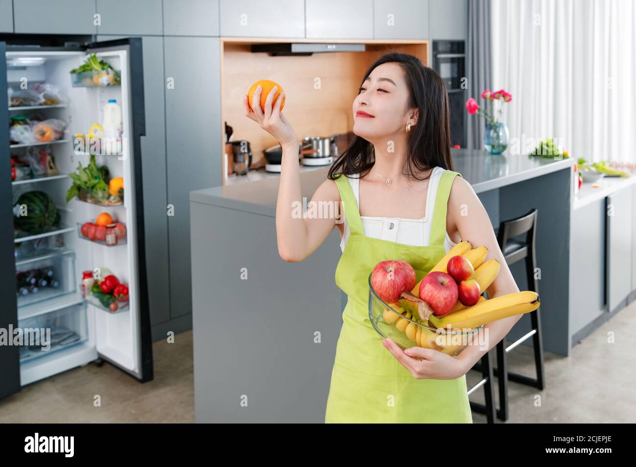 Women refrigerator home hi-res stock photography and images - Alamy