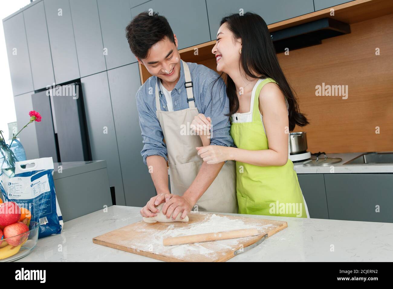 Happy couples of cooking in the kitchen Stock Photo - Alamy