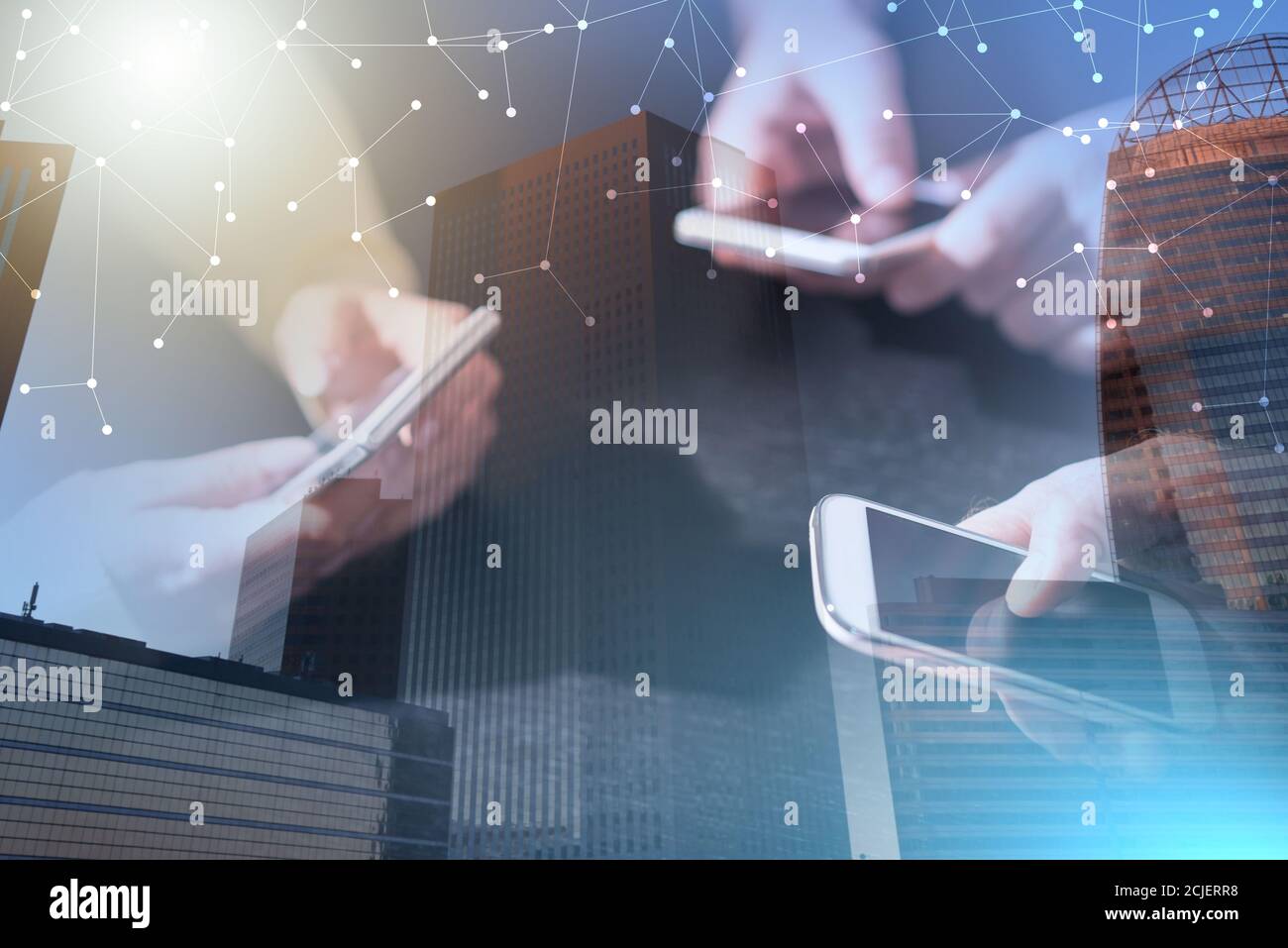 View of people hands using mobile phones; multiple exposure Stock Photo ...
