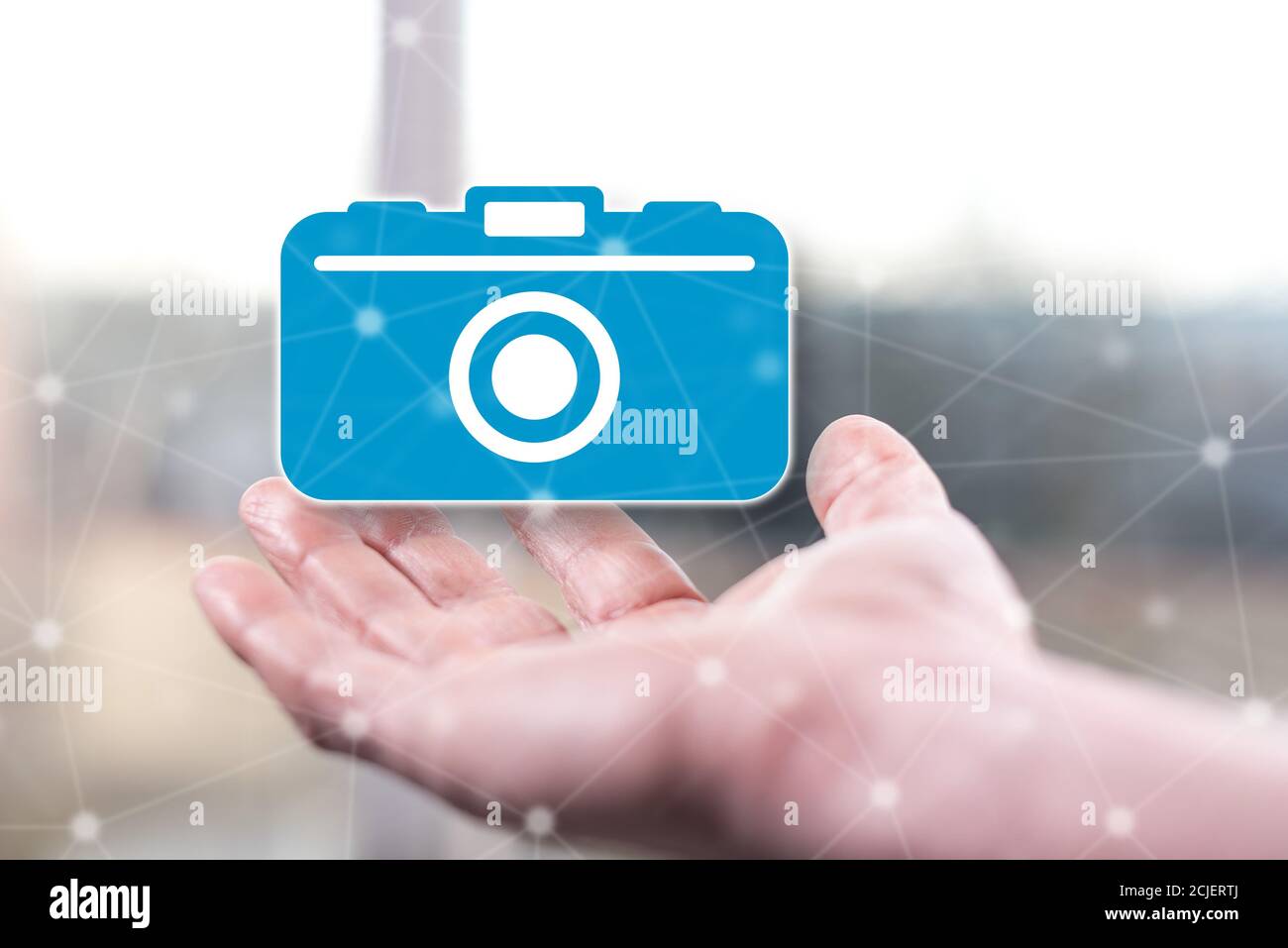 Photography concept above a hand of a man Stock Photo - Alamy