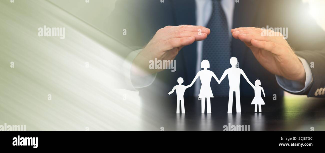 Insurer protecting a family with his hands; light effect Stock Photo ...