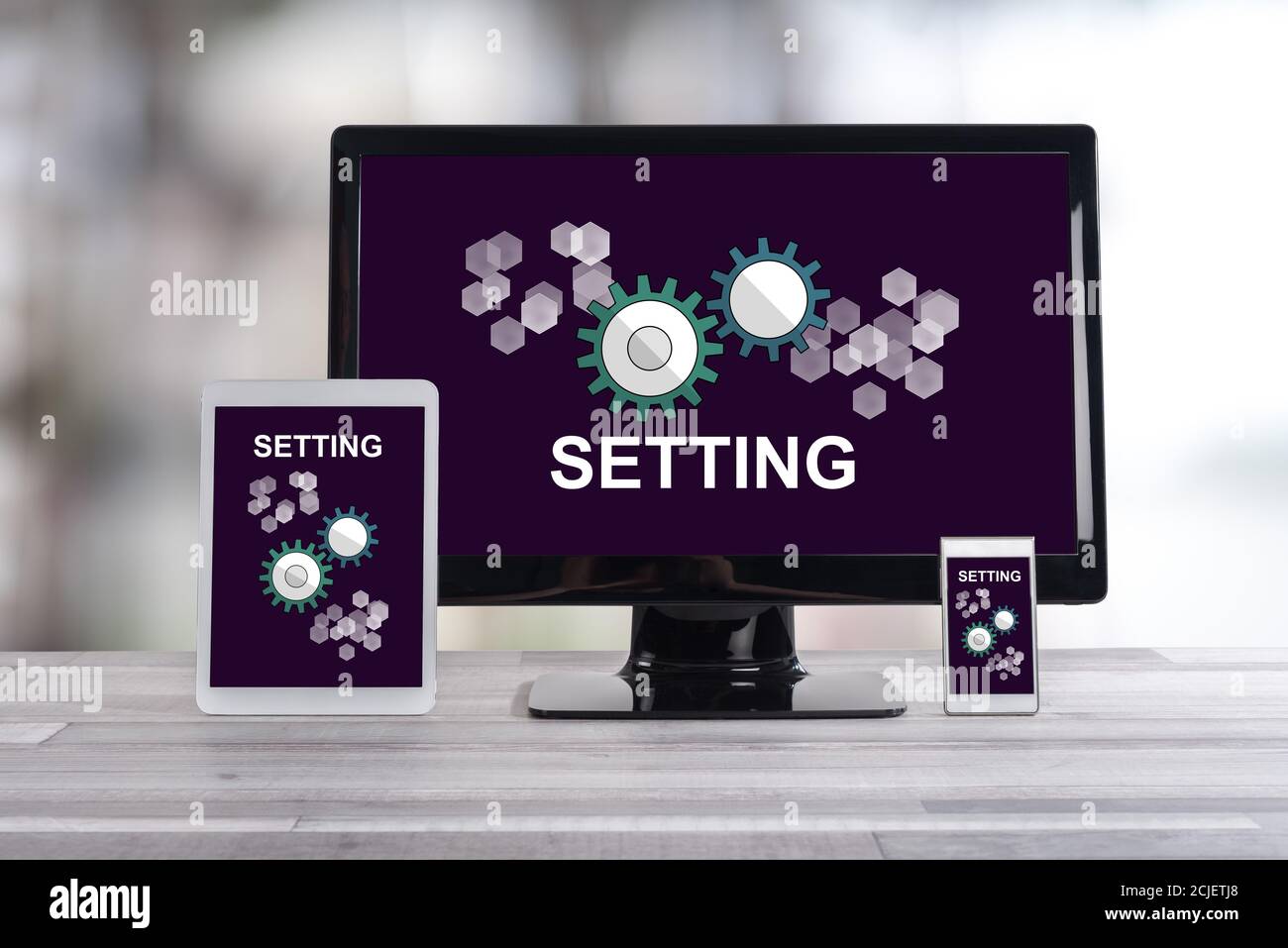 Setting concept shown on different information technology devices Stock ...
