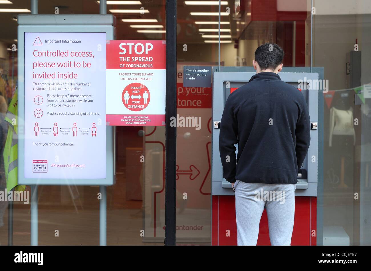 Customer uses a cashpoint at Santander on the High Street, Worcester ...