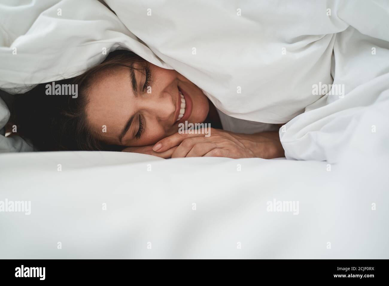 Beautiful lady with a happy smile napping peacefully Stock Photo - Alamy