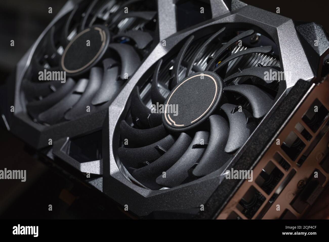 close up of video card with two coolers on dark background. concept ...