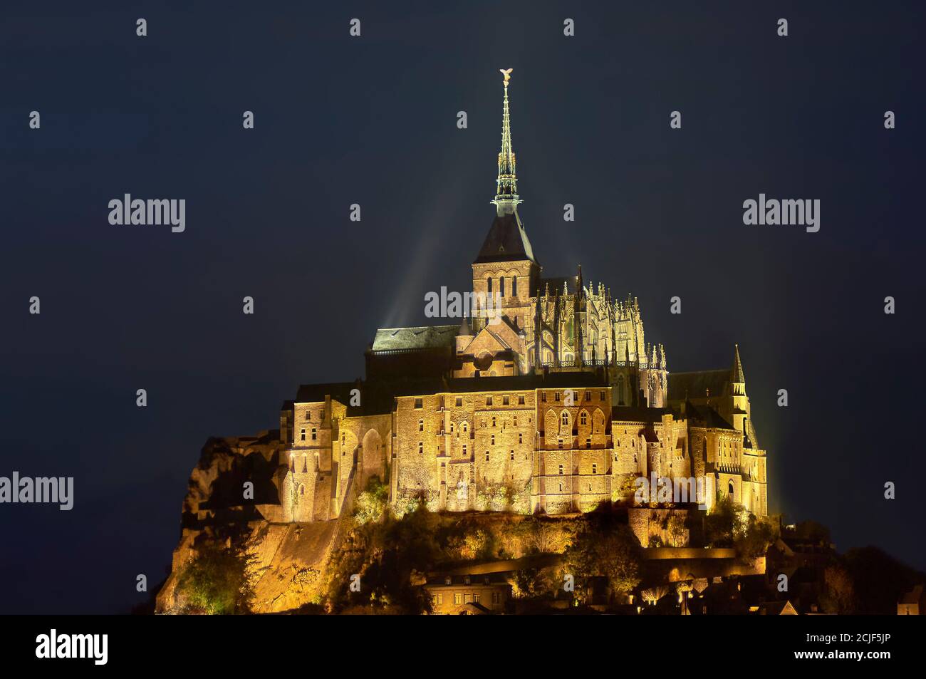 Scenic view of the tidal island of Mont Saint Michel at night at high ...