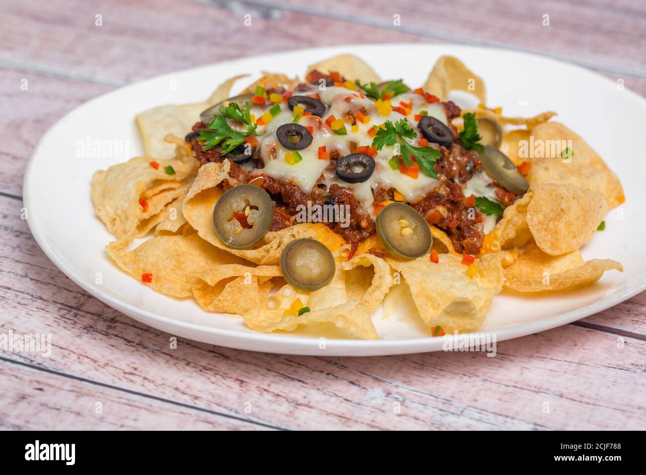 Mexican Famous Food Spicy Ground Beef Nachos. Heated crunchy tortilla ...
