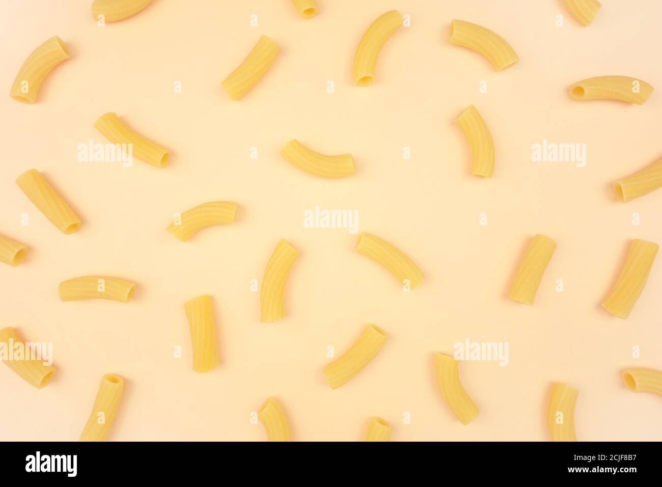 Macaroni pattern on ocher background. Italian food. Pasta composition ...