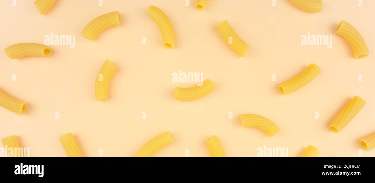 Macaroni pattern on ocher background. Italian food. Pasta composition ...