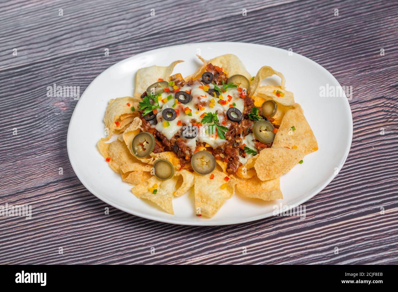 Mexican Famous Food Spicy Ground Beef Nachos. Heated crunchy tortilla ...