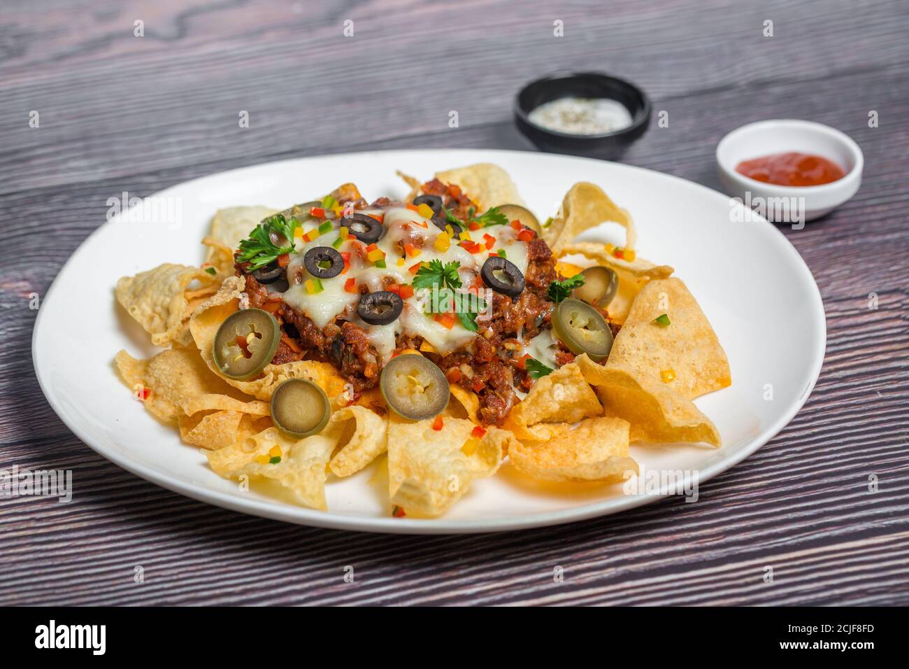 Mexican Famous Food Spicy Ground Beef Nachos. Heated crunchy tortilla ...