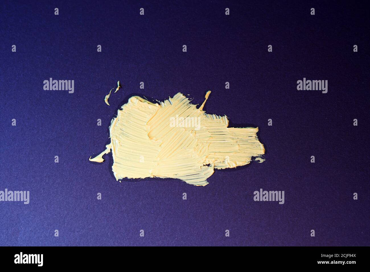 Closeup of a messy putty work on a blue wall Stock Photo - Alamy