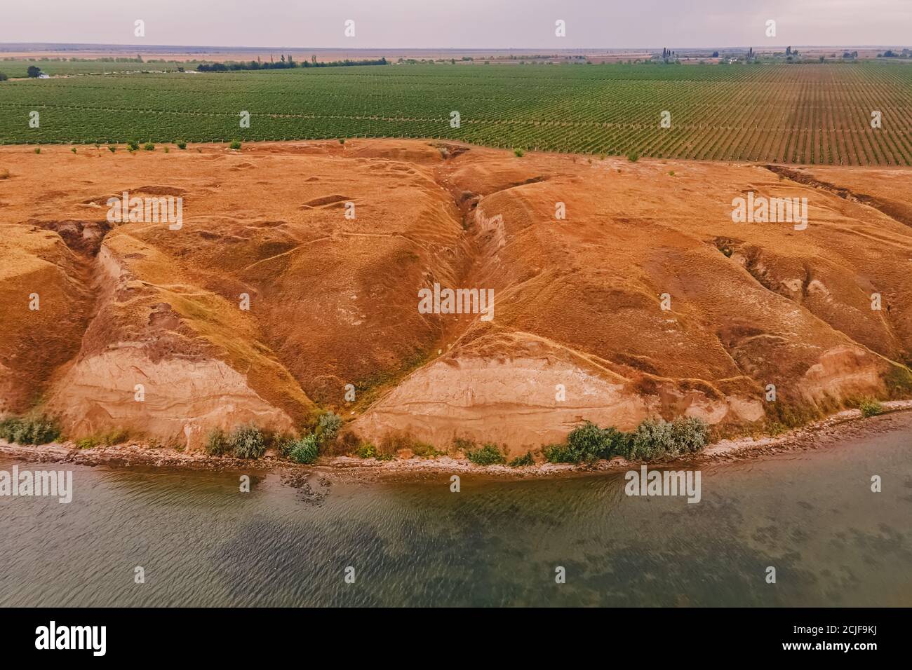Aerial view of clay hills with canyons near the sea Stock Photo - Alamy