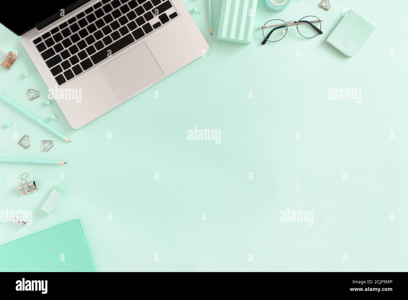 Border frame made of laptop and stationery on the mint table Stock ...