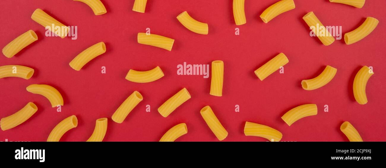 Macaroni pattern on red background. Italian food. Pasta composition ...