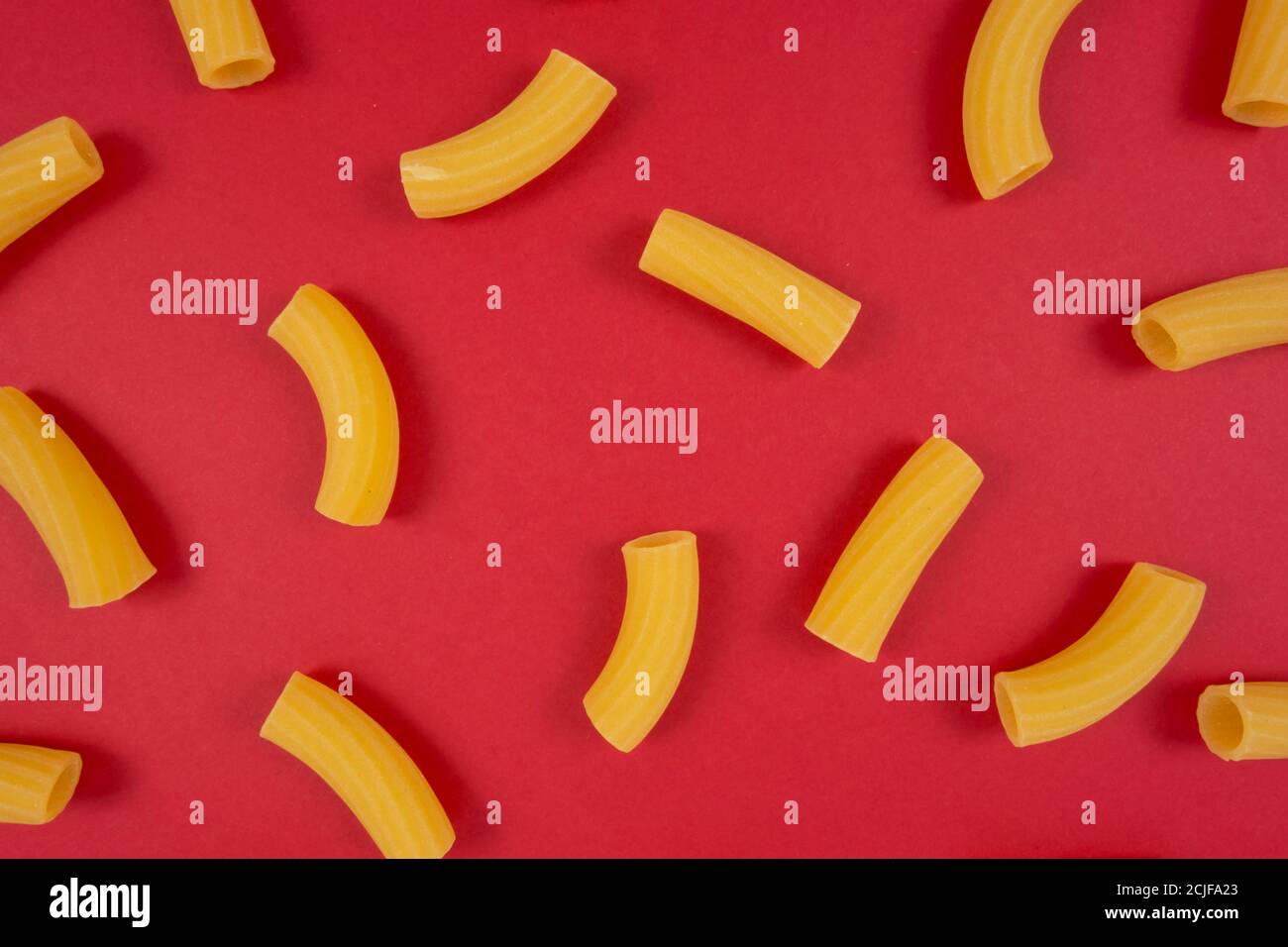 Macaroni pattern on red background. Italian food. Pasta composition ...