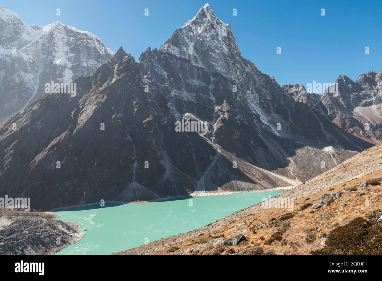 Cholatse towering above lake Chola Tsho on the way to Dzongla Stock ...