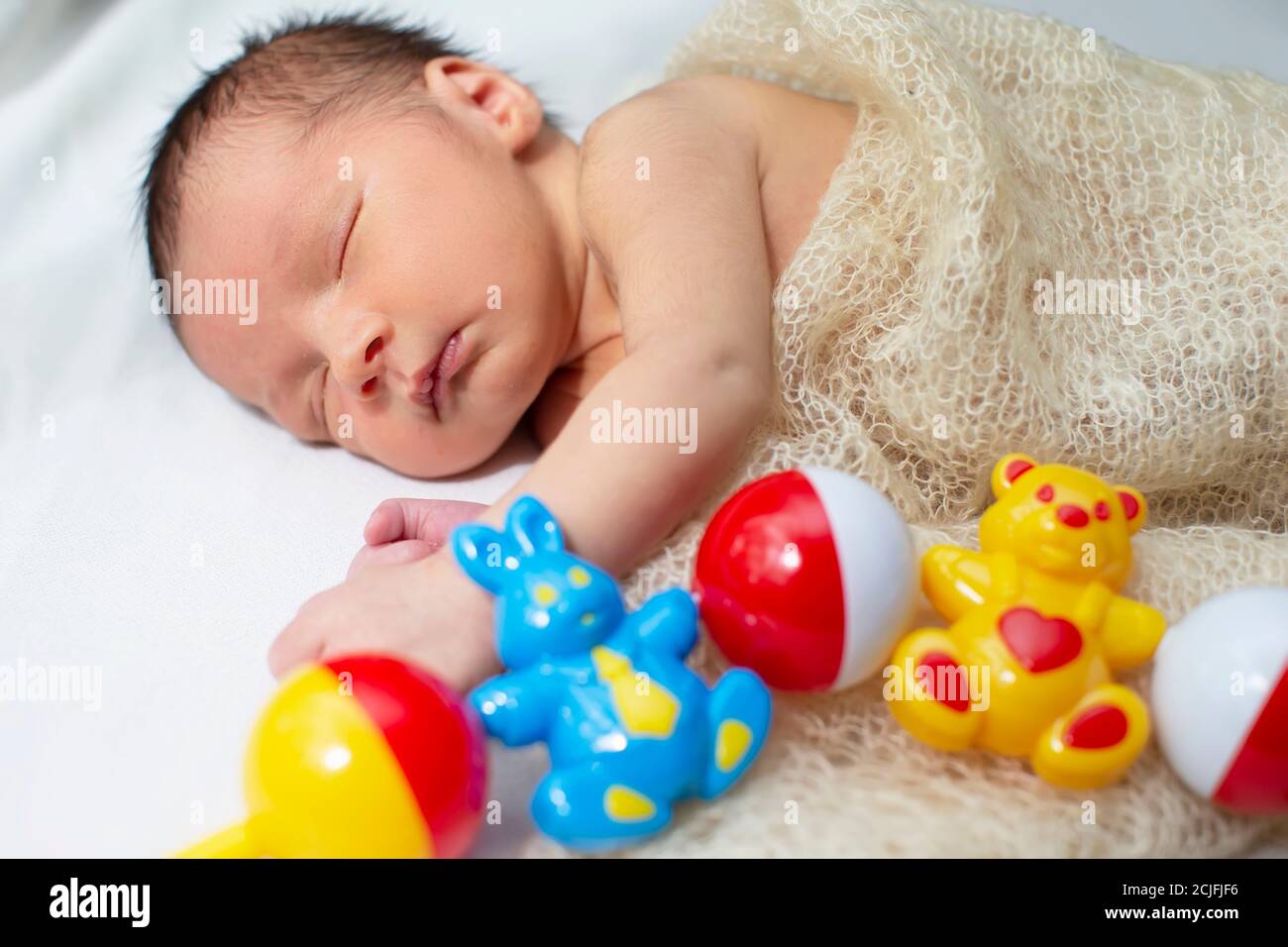 The newborn baby sleeps sweetly.The child is seven days old Stock Photo ...