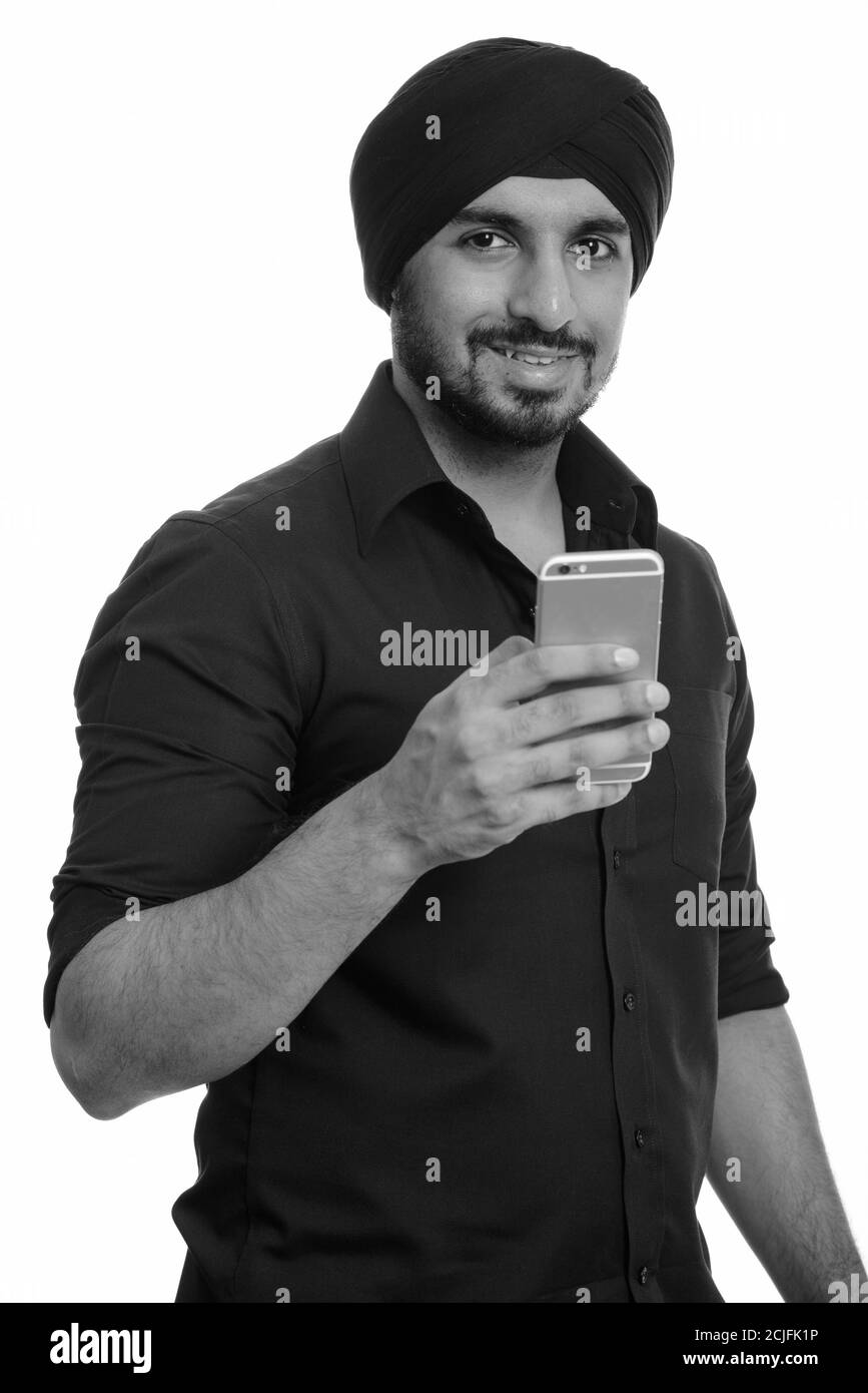Indian man using phone Black and White Stock Photos & Images - Alamy