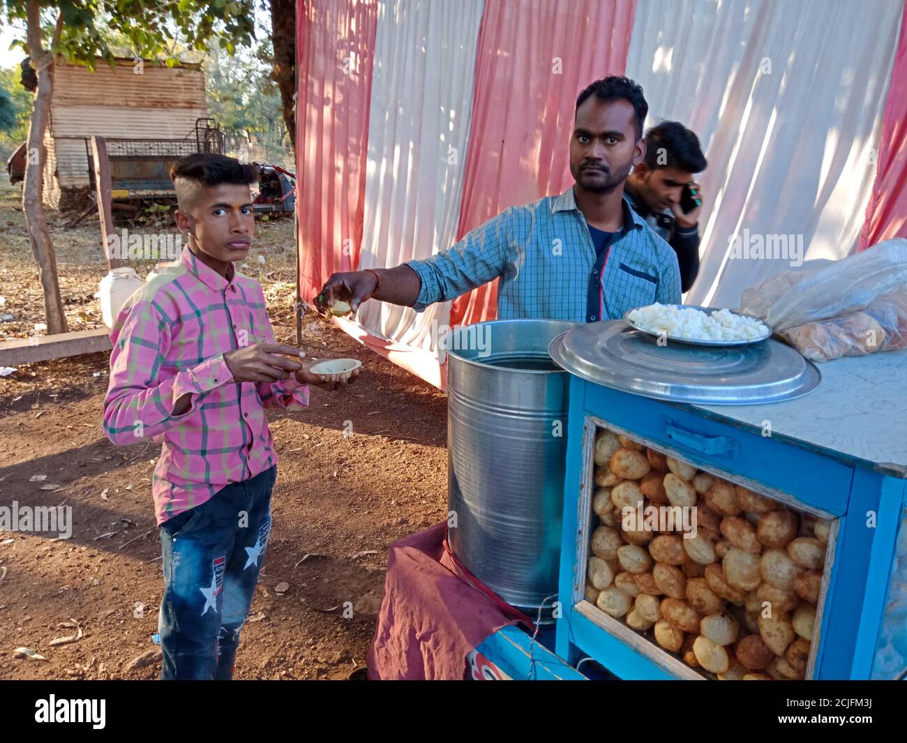 DISTRICT KATNI, INDIA - FEBRUARY 02, 2020: an indian man giving ...