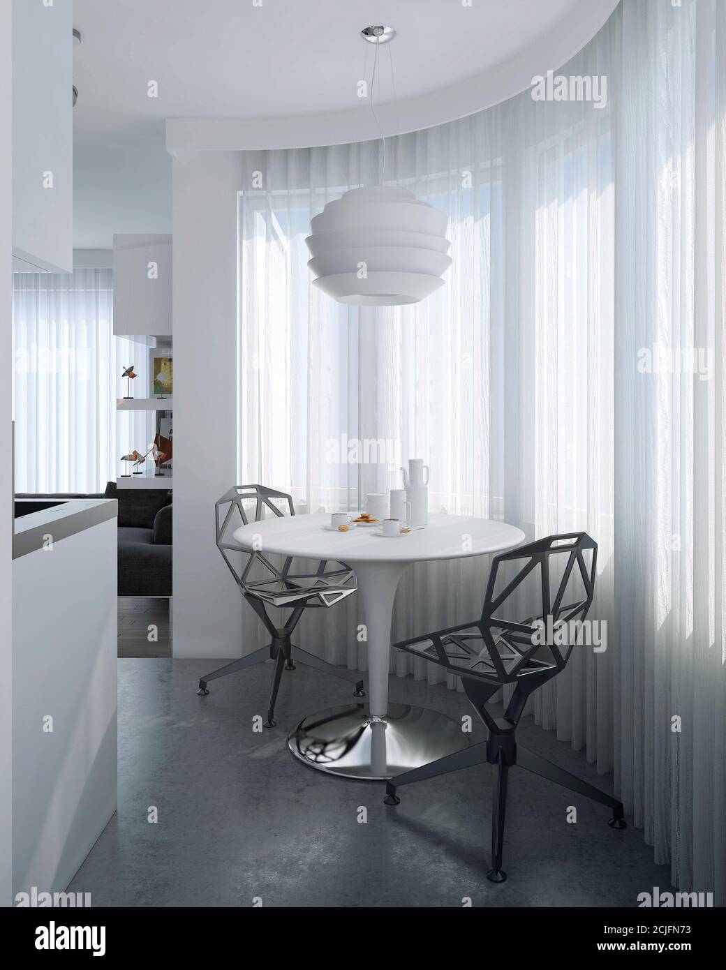 Contemporary dining area with table and two designer chairs in the ...