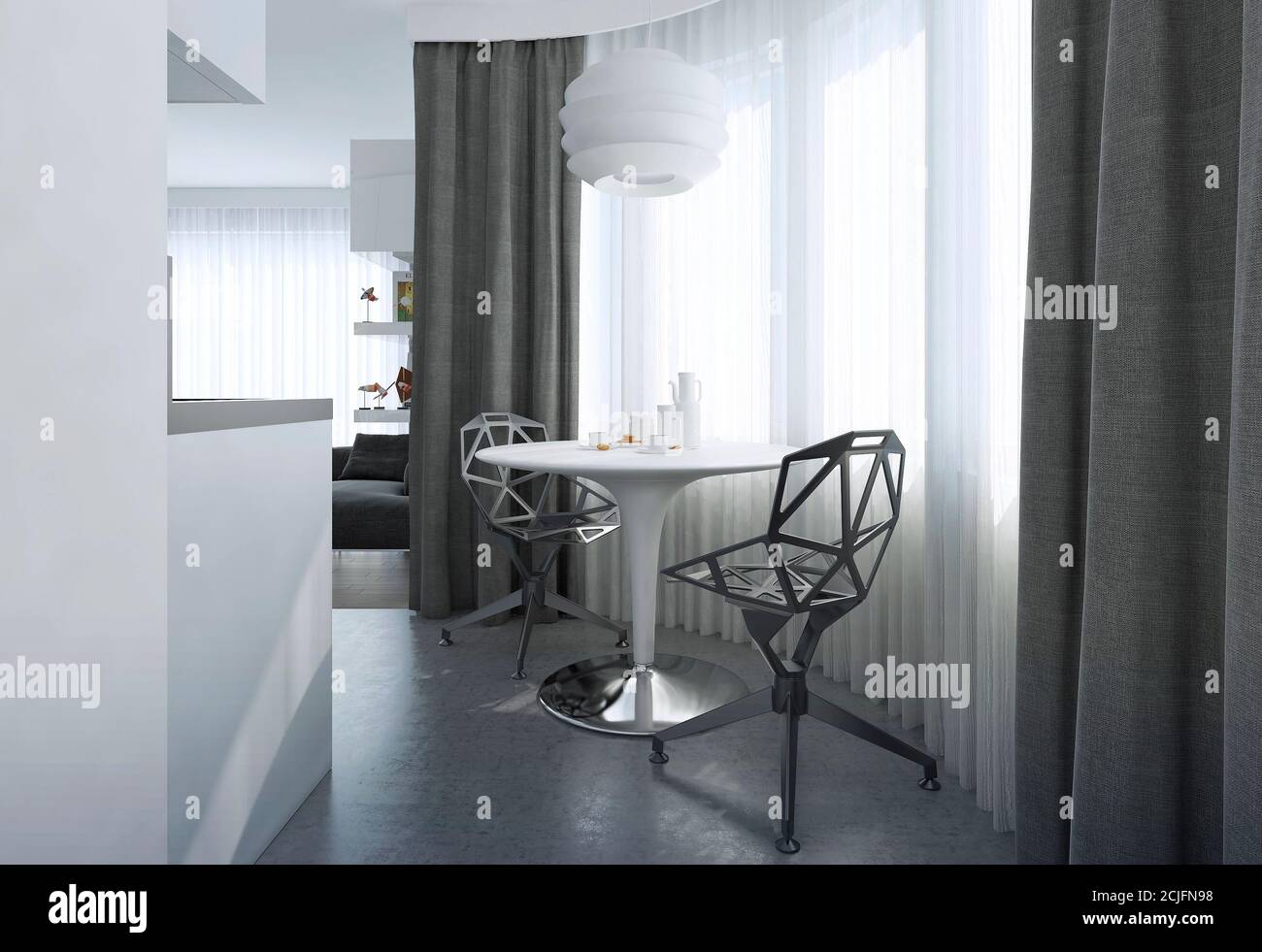 Contemporary dining area with table and two designer chairs in the ...