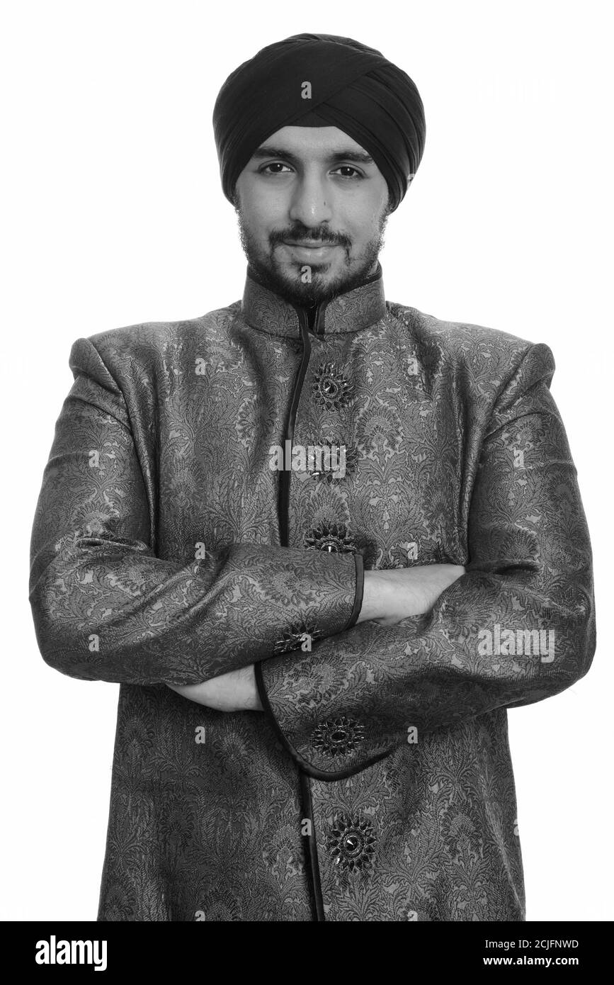 Young handsome Indian Sikh man wearing traditional clothes Stock Photo ...