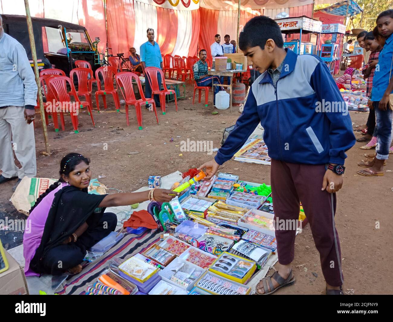 DISTRICT KATNI, INDIA - FEBRUARY 02, 2020: Asian poor children buying ...