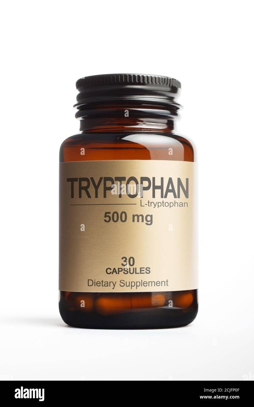 Bottle with L-tryptophan capsules isolated on white background Stock ...