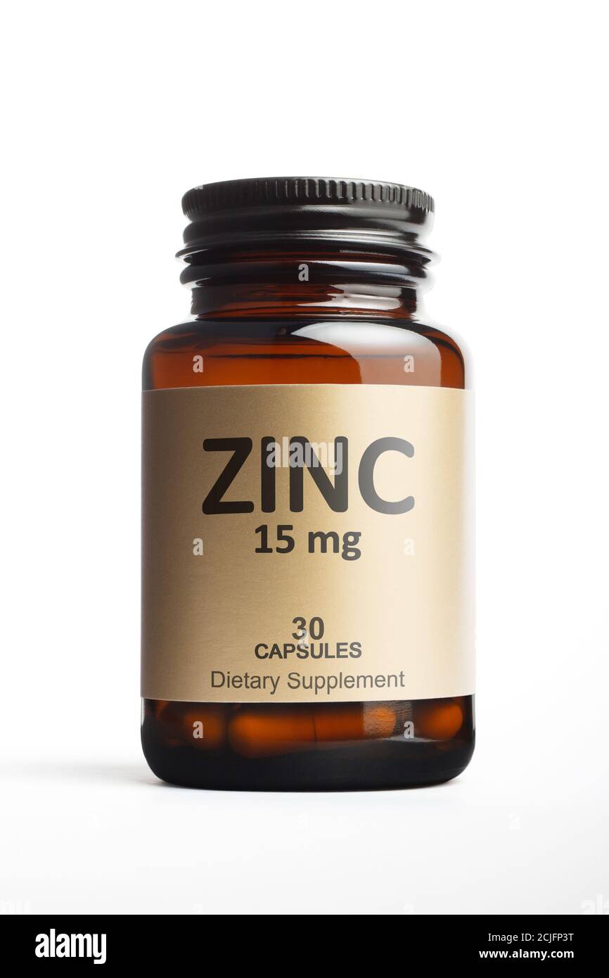Bottle with Zinc capsules isolated on white background Stock Photo - Alamy