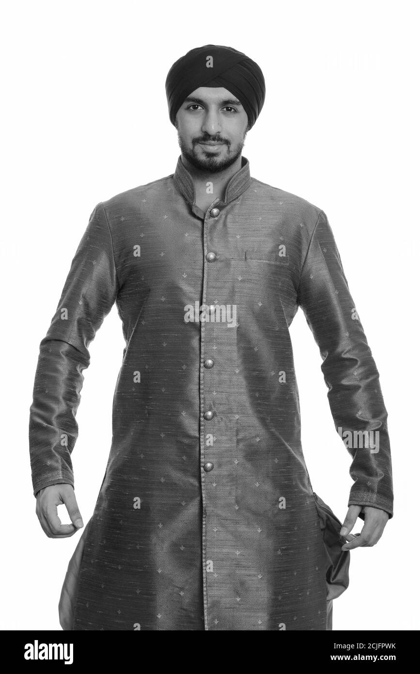 Young handsome Indian Sikh man wearing traditional clothes Stock Photo ...
