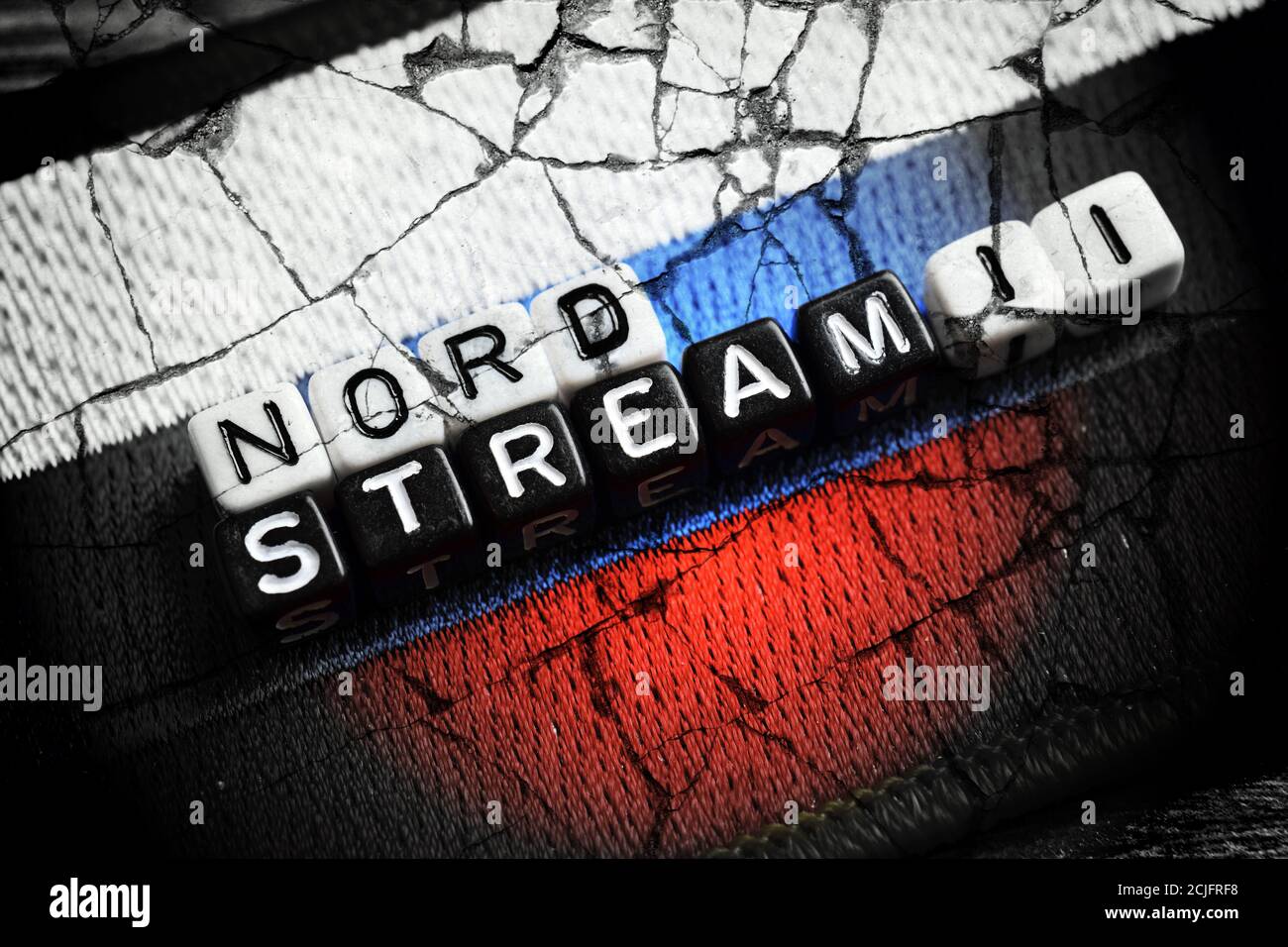 Letter cubes forming the words Nord Stream 2 on the flag of Russia ...