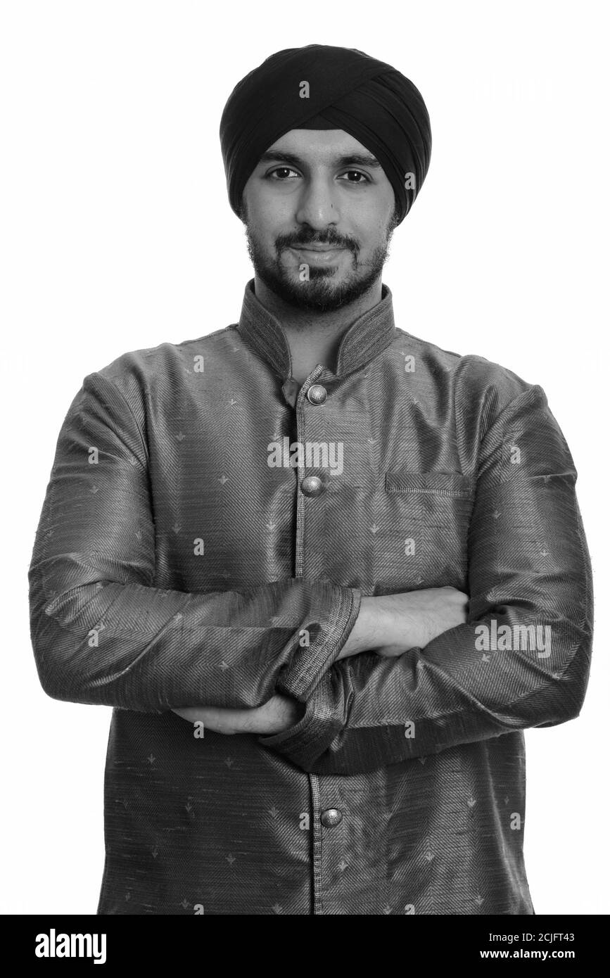 Young handsome Indian Sikh man wearing traditional clothes Stock Photo ...