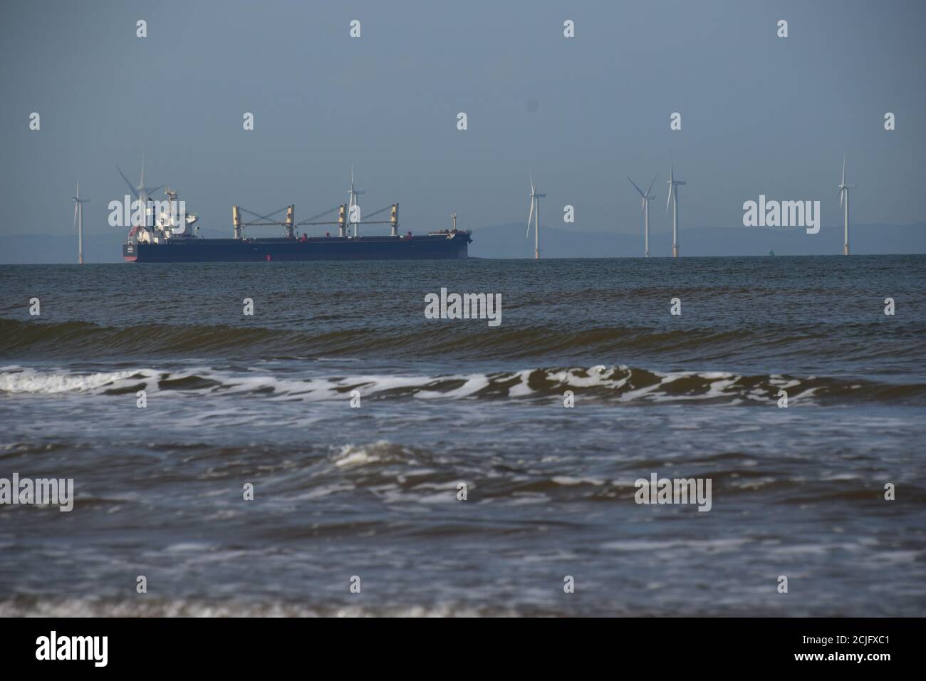Ship on the horizon in Liverpool bay Stock Photo - Alamy