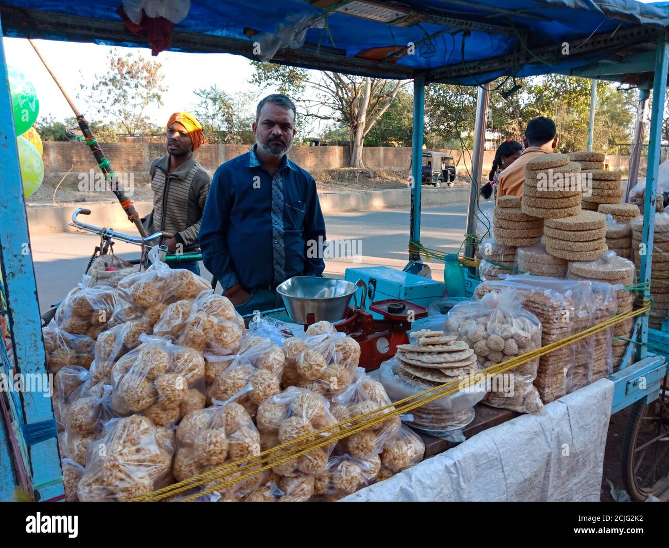 DISTRICT KATNI, INDIA - FEBRUARY 02, 2020: an asian man selling ...